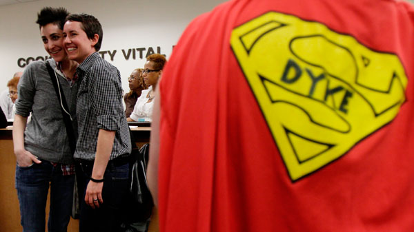Robin Petrovic and Jamie Gayle embrace after they received their Civil ...