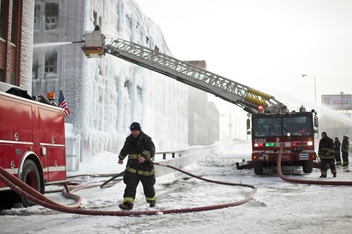 Chicago Firefighters continue to battle a warehouse fire for a third ...