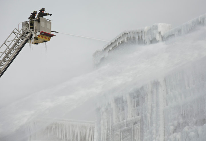 Chicago Firefighters continue to battle a warehouse fire for a third ...